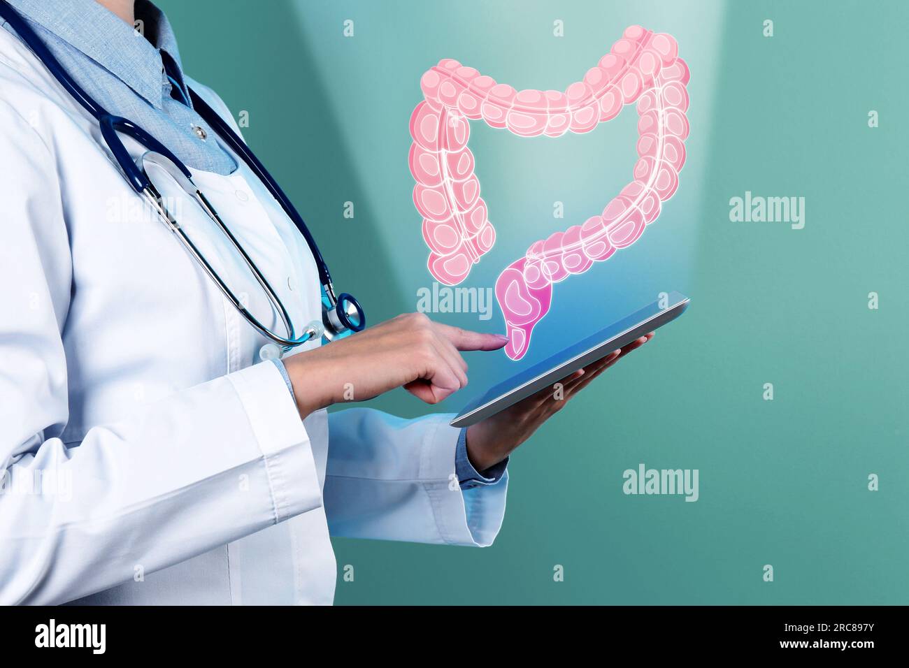 Gastroenterologist holding tablet computer on teal background, closeup ...