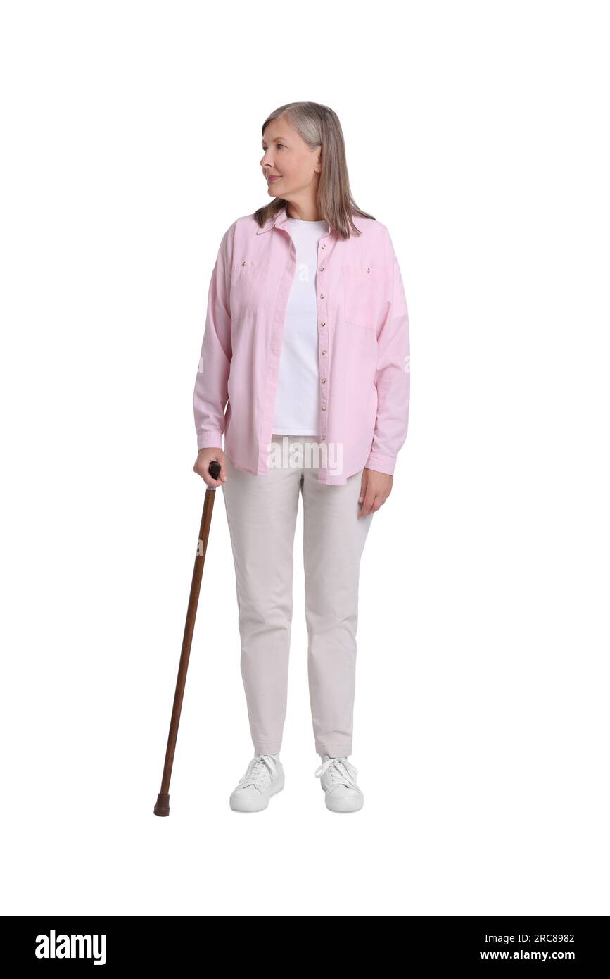 Senior woman with walking cane on white background Stock Photo - Alamy