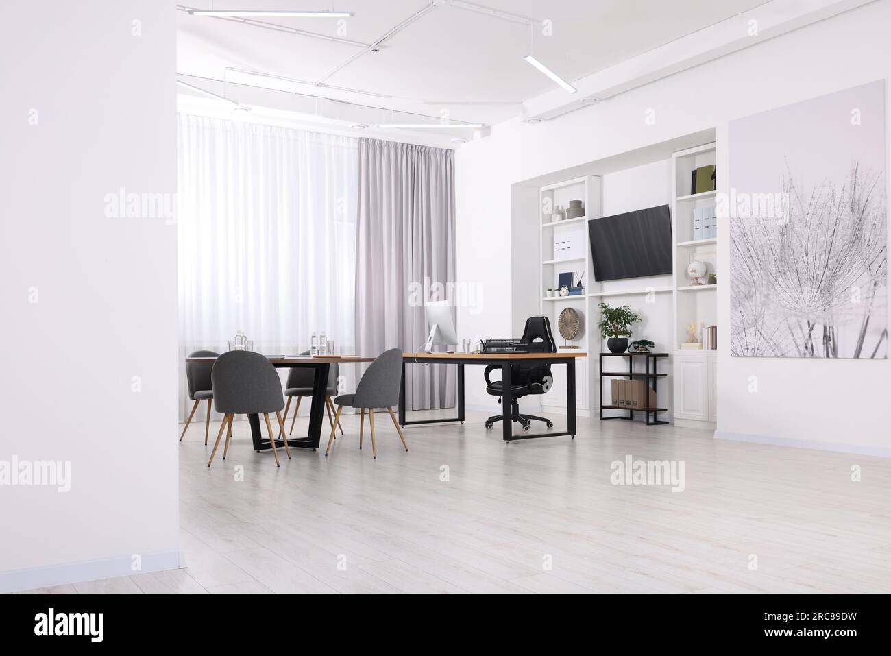 Stylish office with comfortable furniture and tv zone. Interior design ...