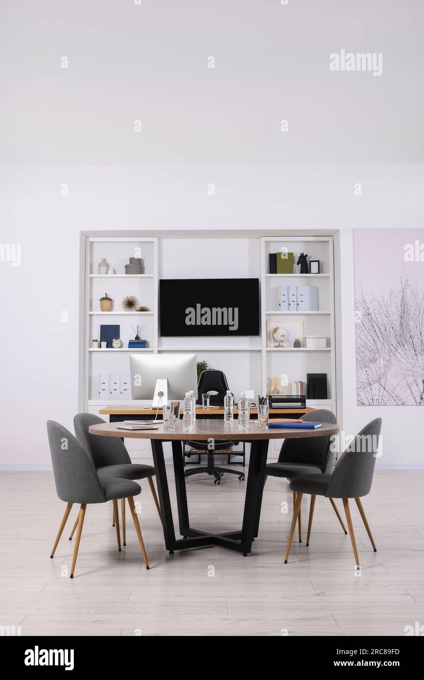 Stylish office with comfortable furniture and tv zone. Interior design ...