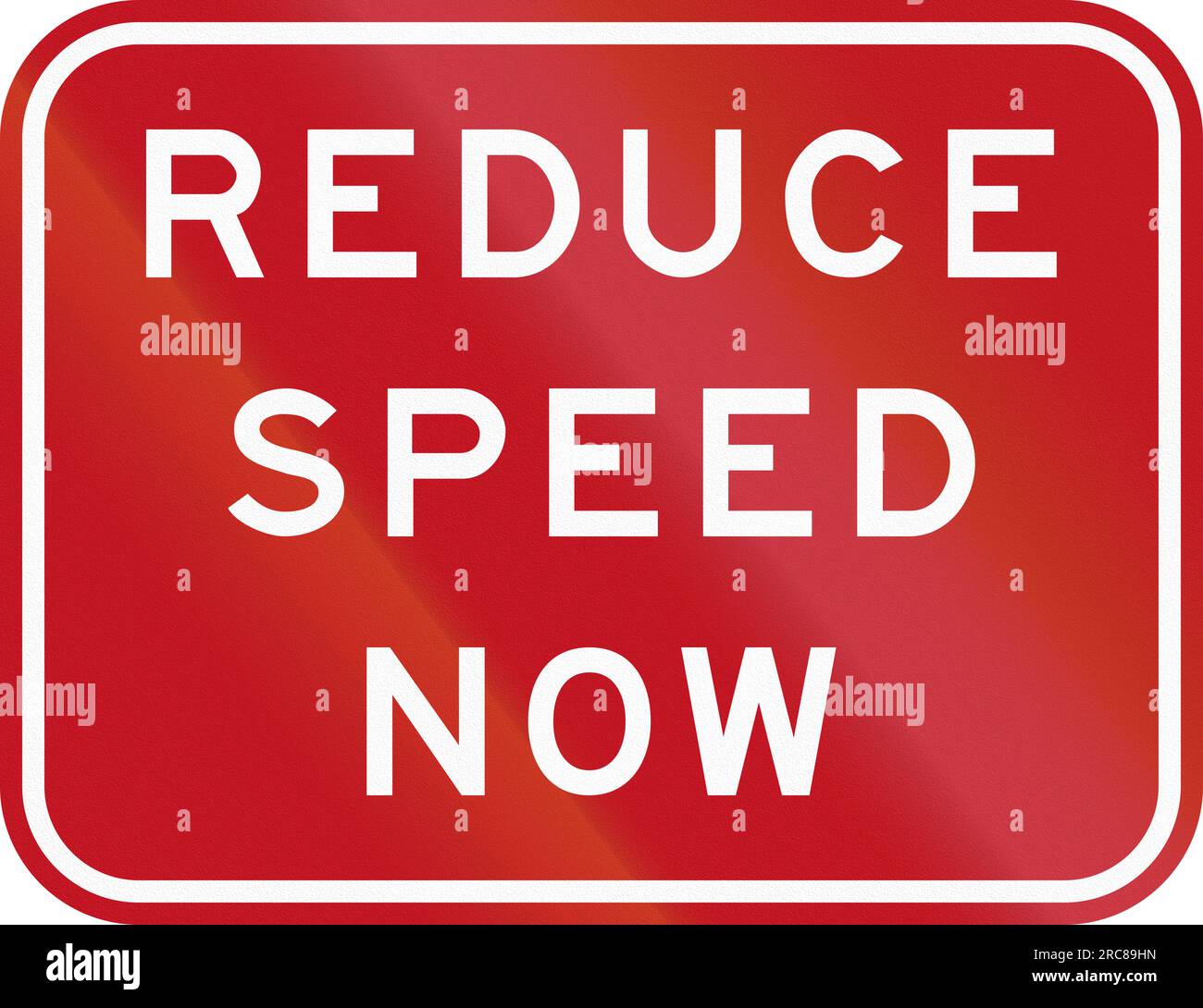 An Australian road sign: Reduce speed now Stock Photo - Alamy