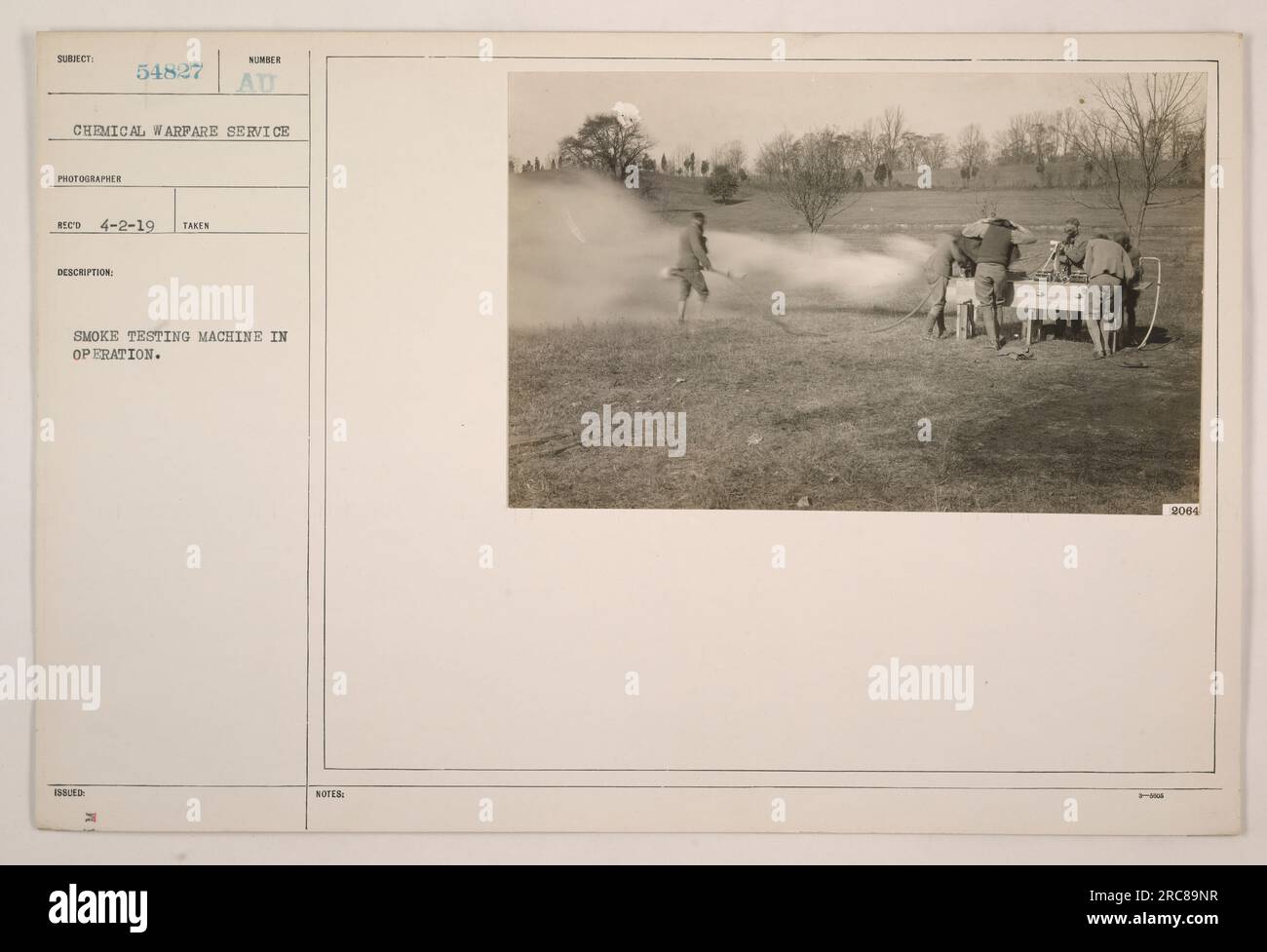 Smoke testing machine in operation during World War I. The photograph ...