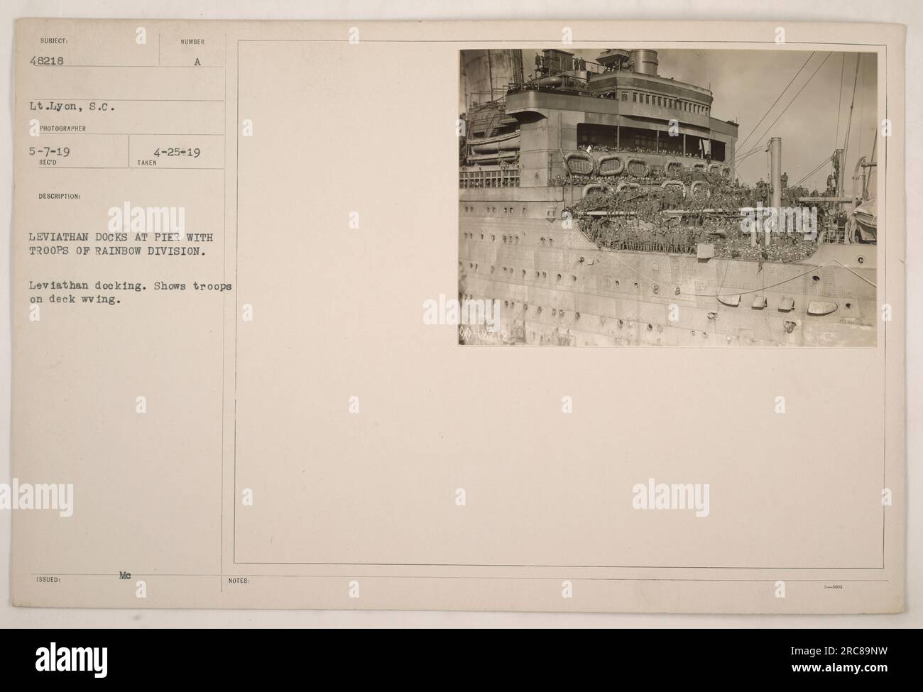 Leviathan, a military ship, docks at a pier with troops from the ...