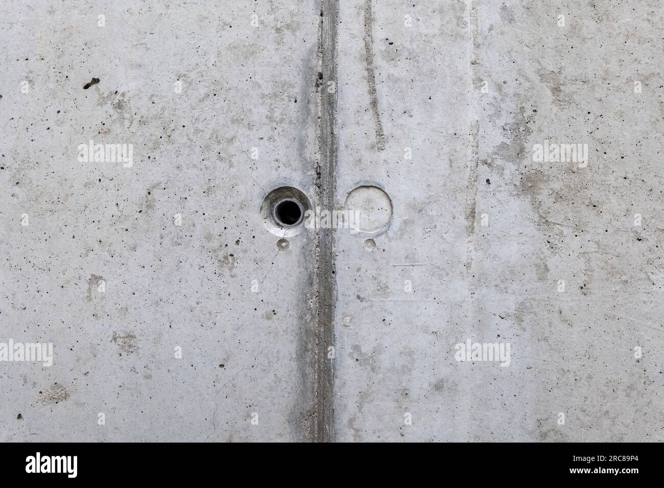Mounting holes in the wall made of architectural concrete Stock Photo ...
