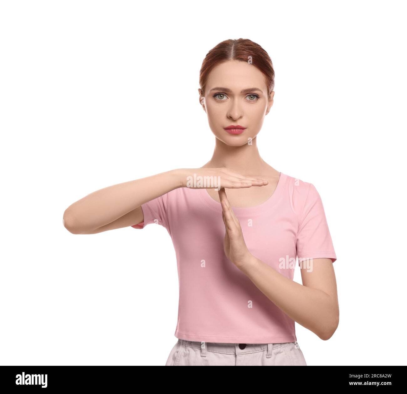 Woman showing time out gesture on white background Stock Photo - Alamy