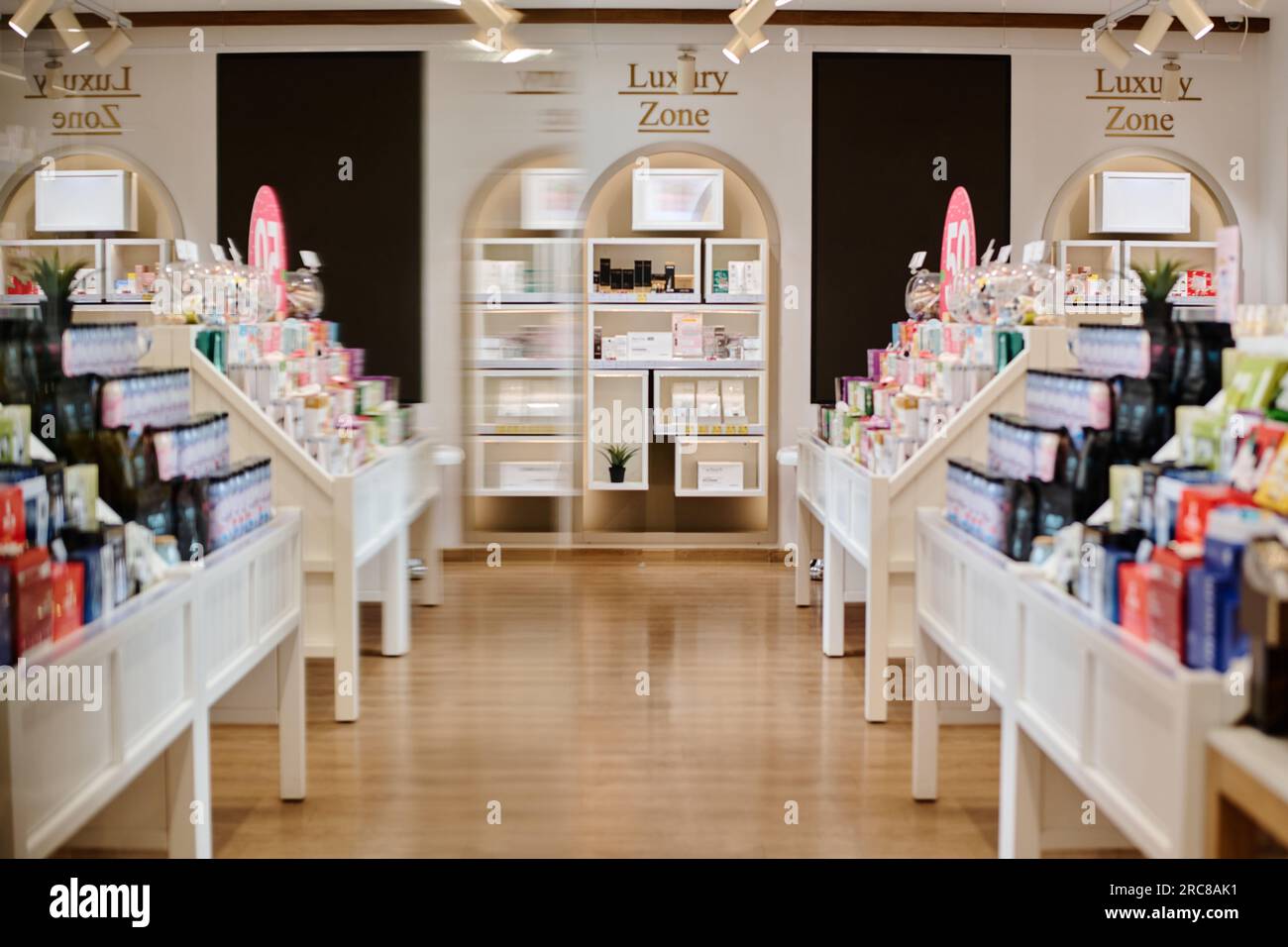 Modern interior of cosmetics store with products on the shelves in ...