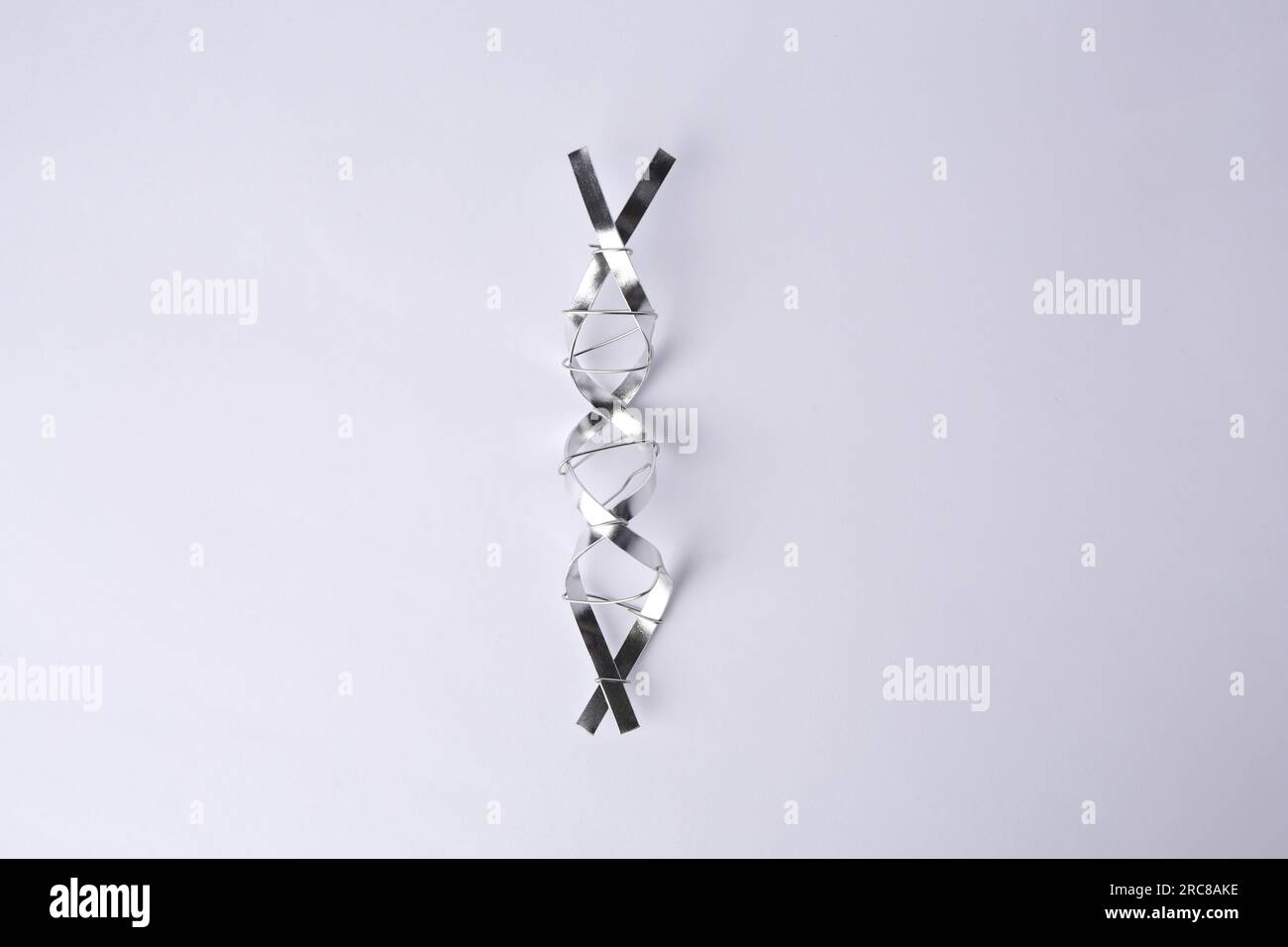 DNA molecular chain made of metal on white background, top view Stock ...
