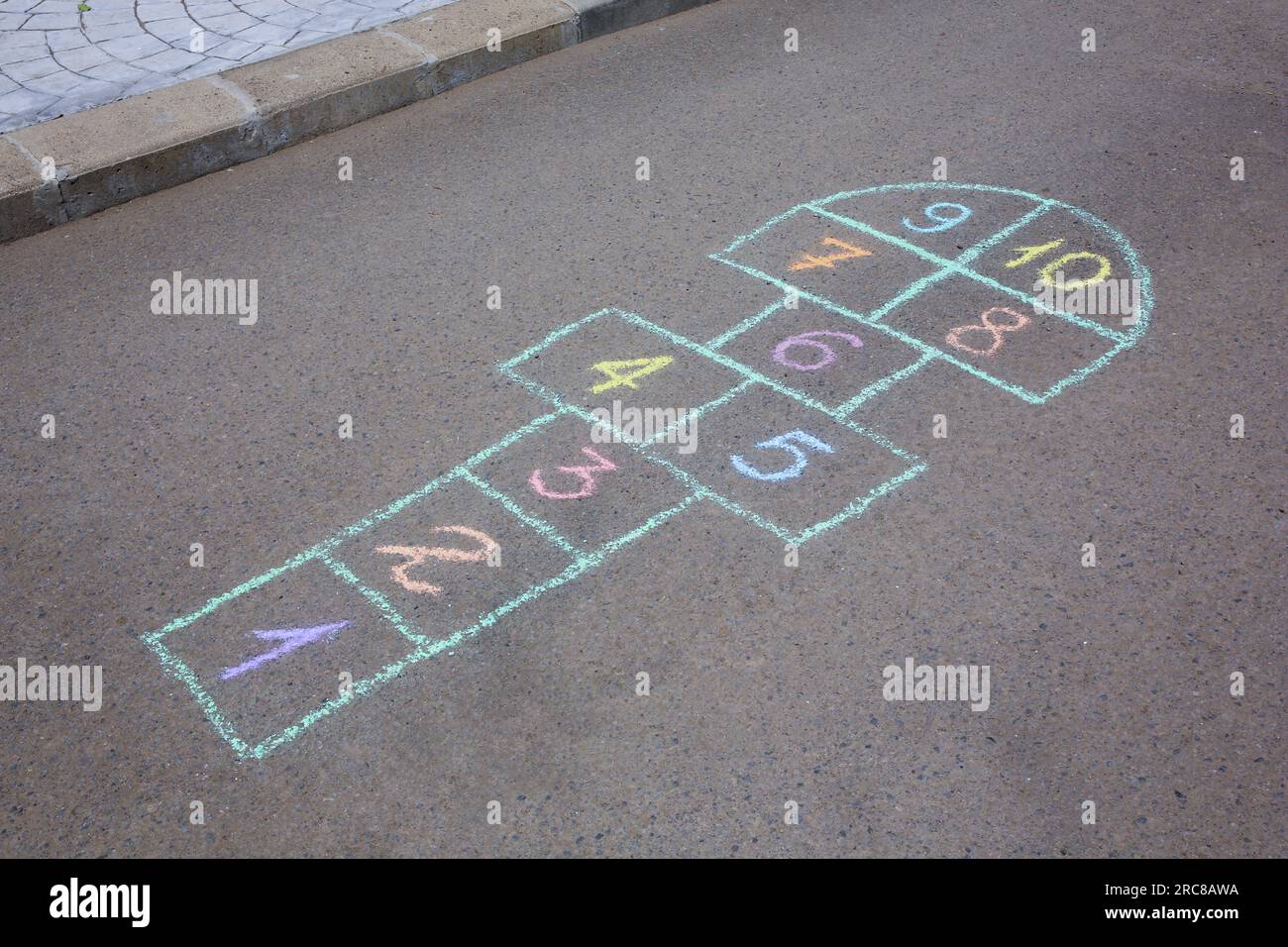 Hopscotch drawn with colorful chalk on asphalt outdoors Stock Photo - Alamy