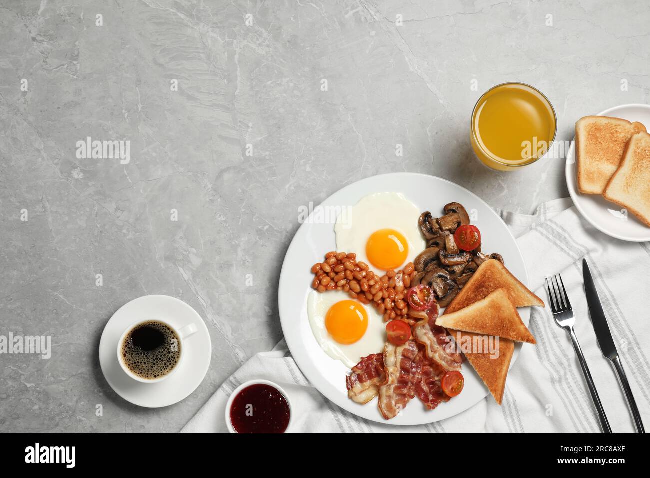 Traditional English breakfast served on grey marble table, flat lay ...