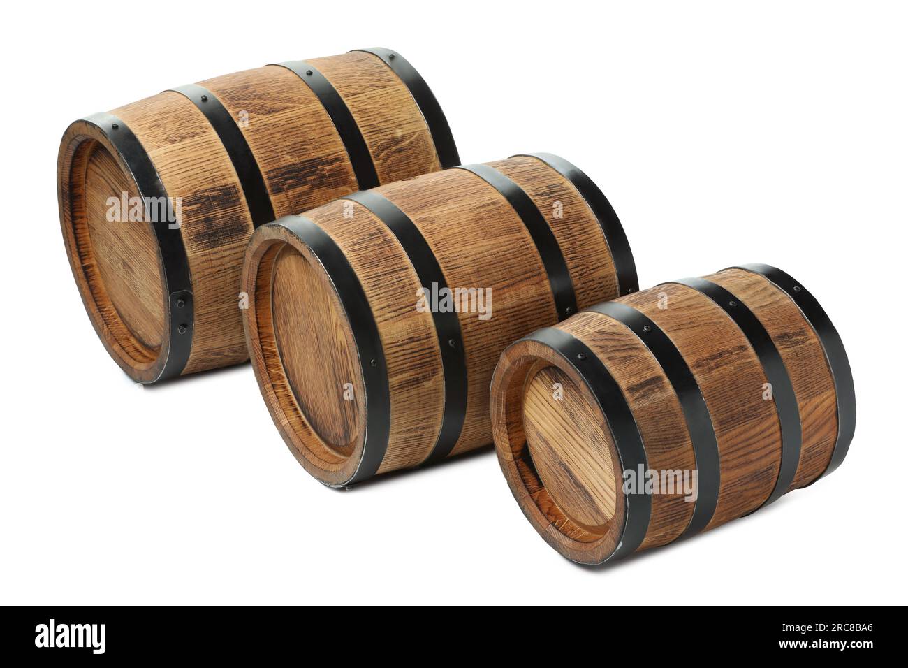 Three traditional wooden barrels on white background Stock Photo - Alamy