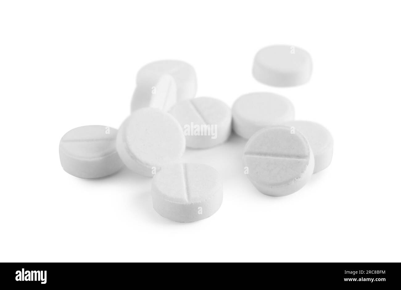 Pile of round pills on white background Stock Photo - Alamy