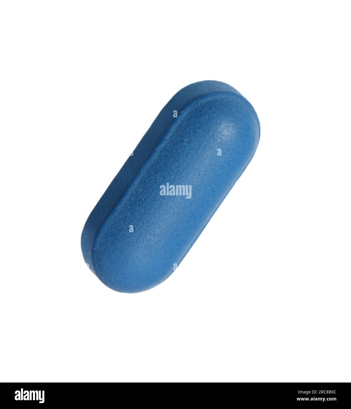 One blue pill on white background. Medicinal treatment Stock Photo - Alamy
