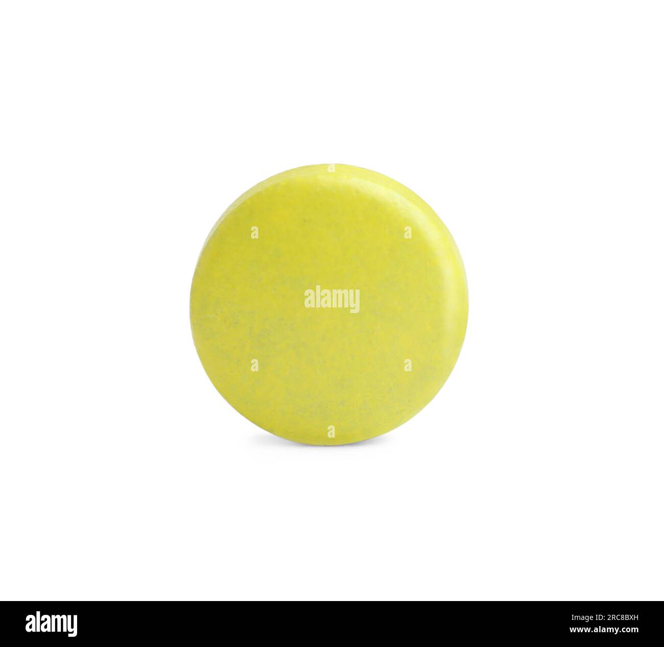 One yellow pill isolated on white. Medicinal treatment Stock Photo - Alamy
