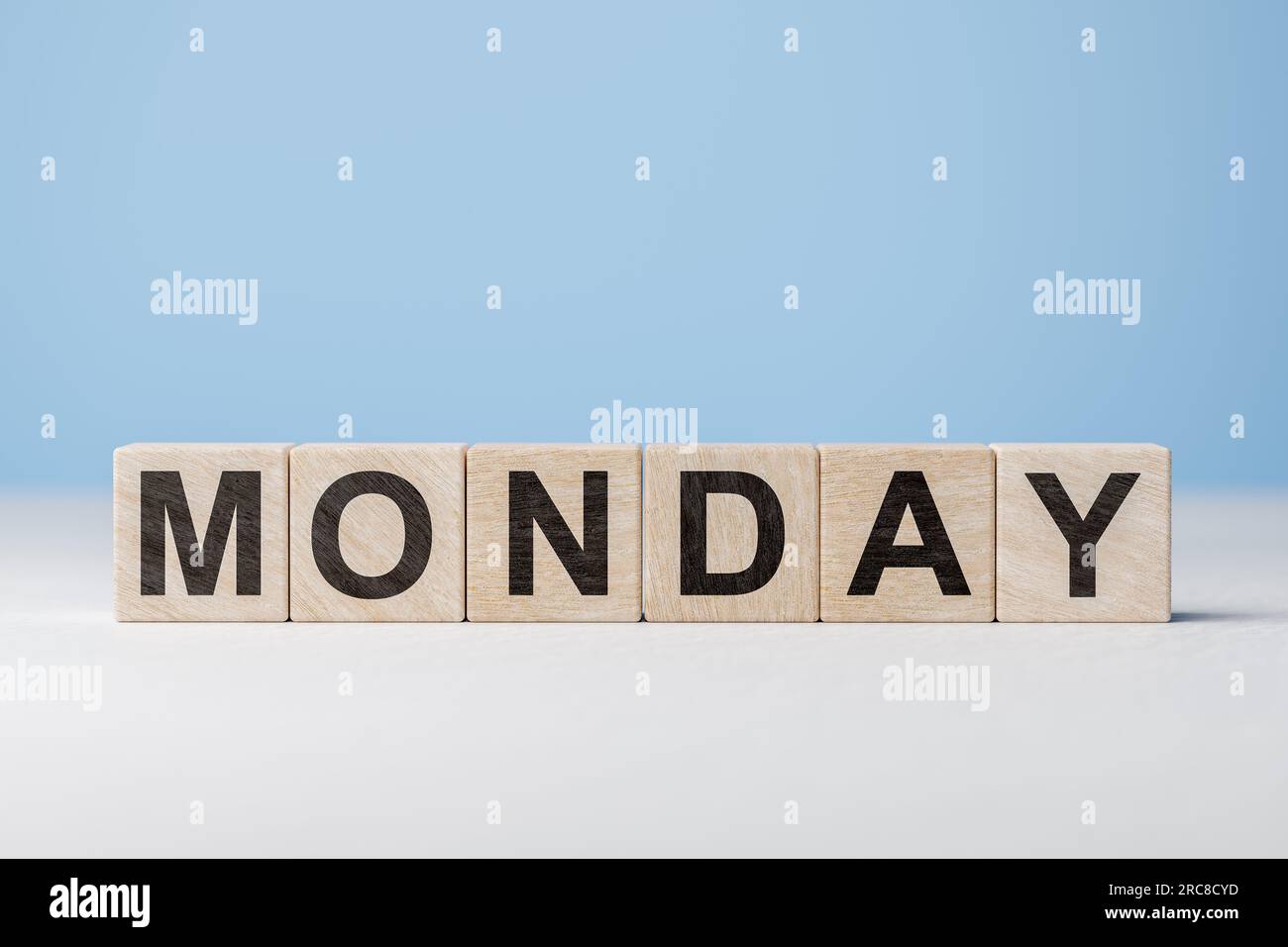 Text Monday on wooden cubes on blue background. Day of week on wood ...