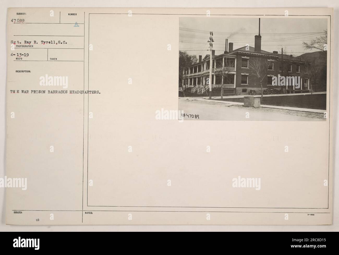 The photograph depicts the war prison barracks headquarters during ...