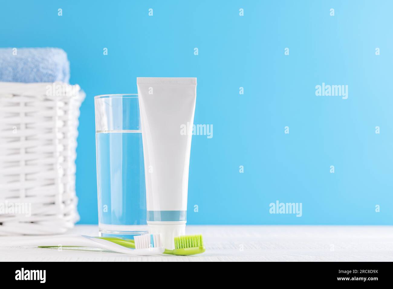 A clean and refreshing image featuring toothpaste and toothbrushes ...