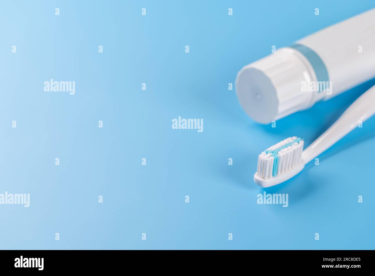 A clean and refreshing image featuring toothpaste and toothbrush ...