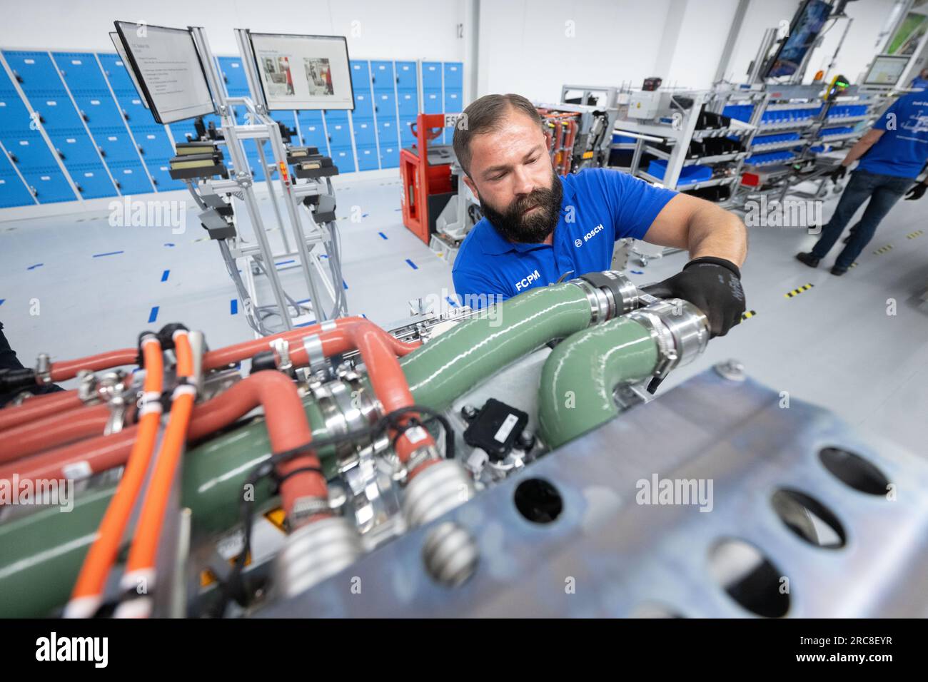 Stuttgart, Germany. 12th July, 2023. A Robert Bosch GmbH employee ...