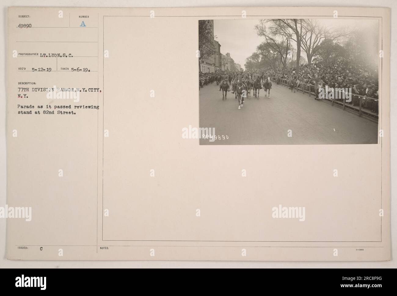 The image shows the 77th Division Parade in New York City, passing the ...