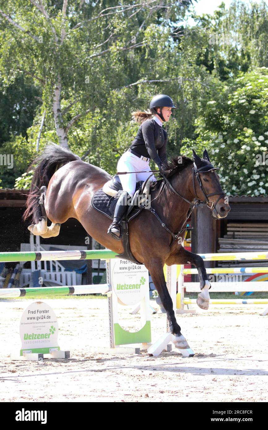riders jump contest in germany Stock Photo - Alamy