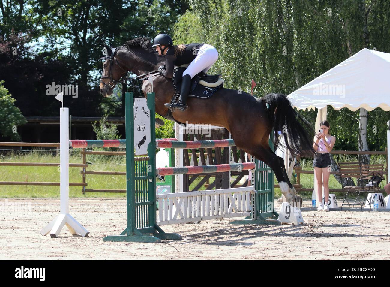 riders jump contest in germany Stock Photo - Alamy