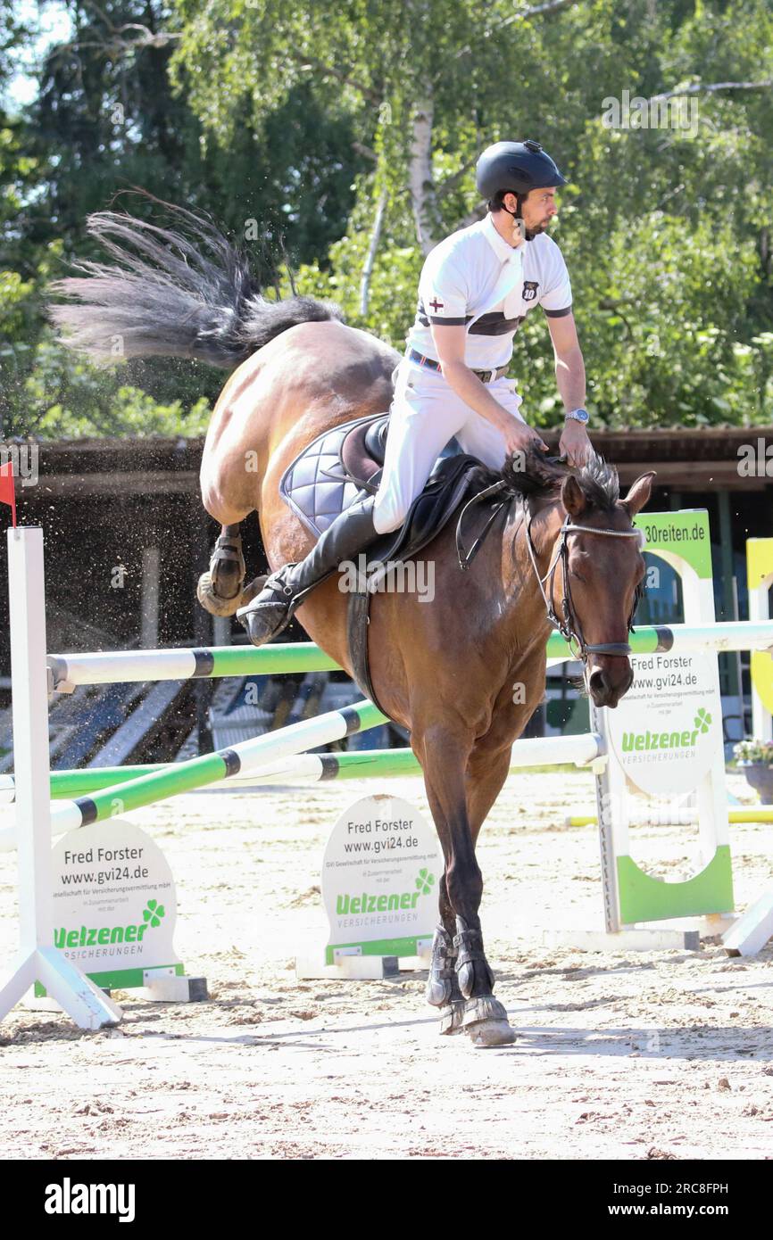 riders jump contest in germany Stock Photo - Alamy