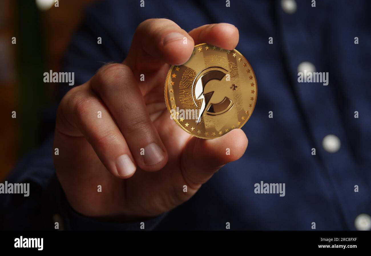 C Charge CCHG EV crypto EV fuel CCharge golden coin in hand abstract ...