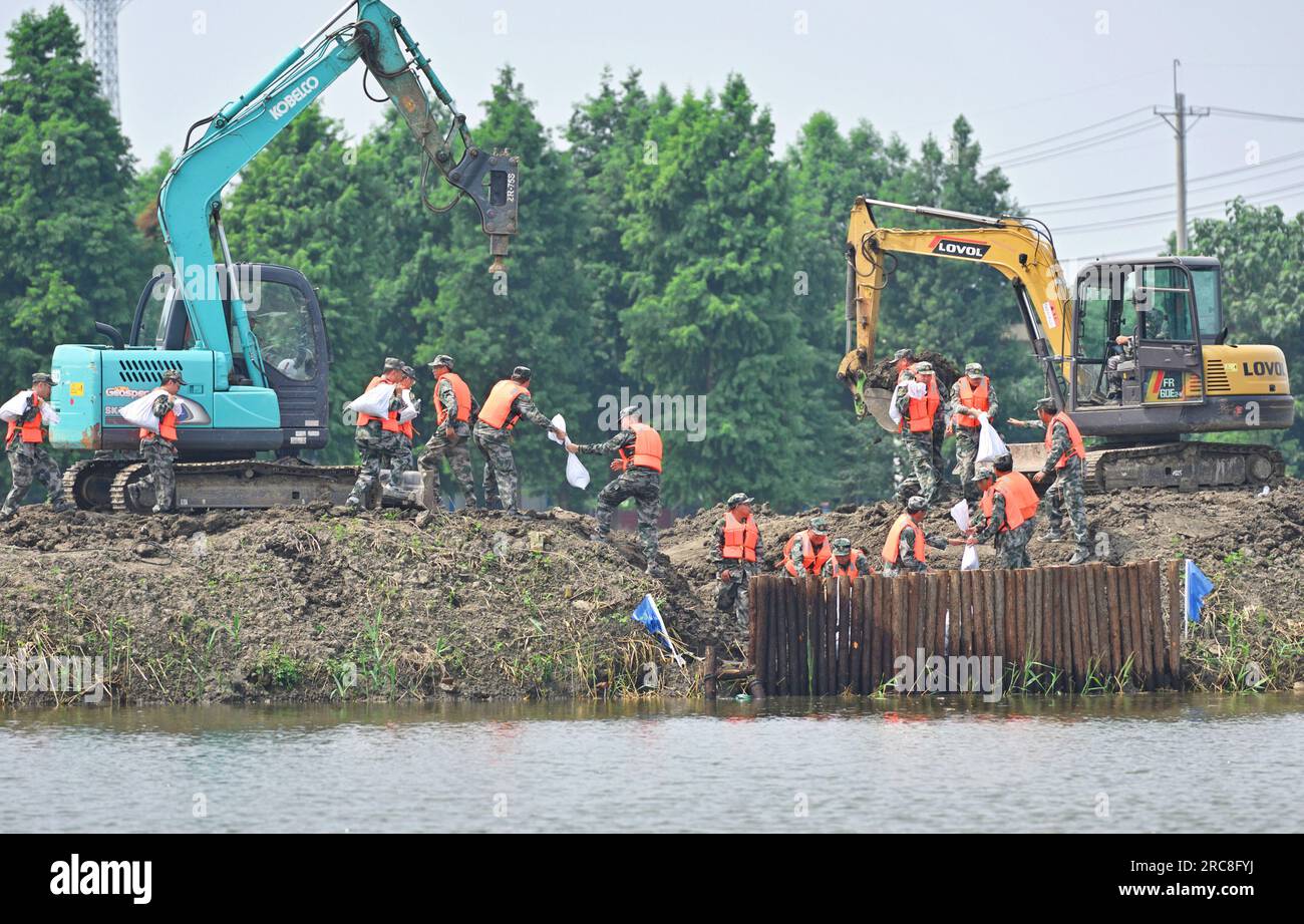 HAI'AN, CHINA - JULY 12, 2023 - An emergency team conducts a drill to ...