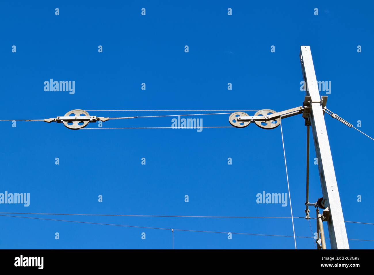 Railroad switch counter weight mechanism against blue sky Stock Photo ...