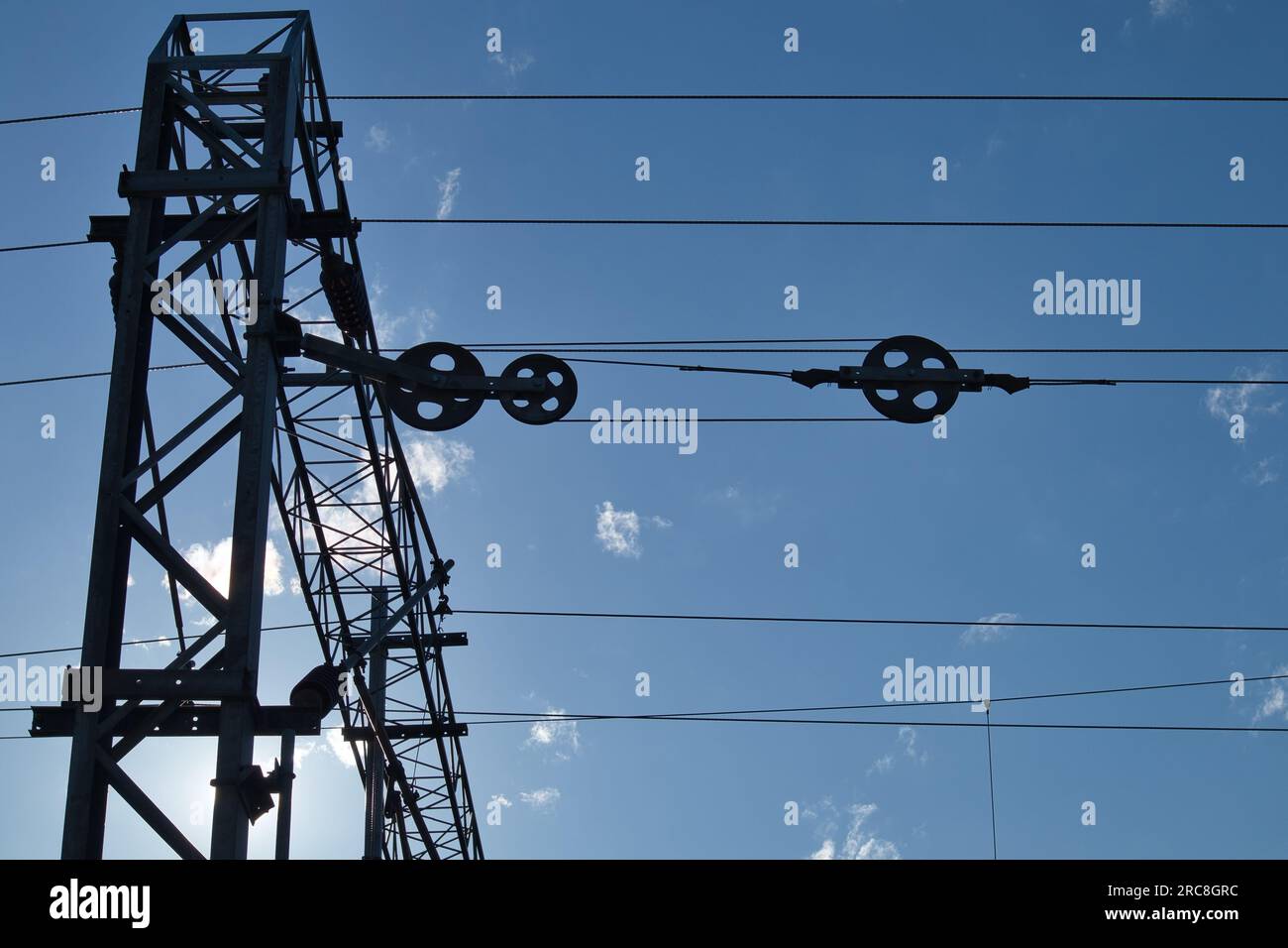 Railroad switch counter weight mechanism against blue sky Stock Photo ...
