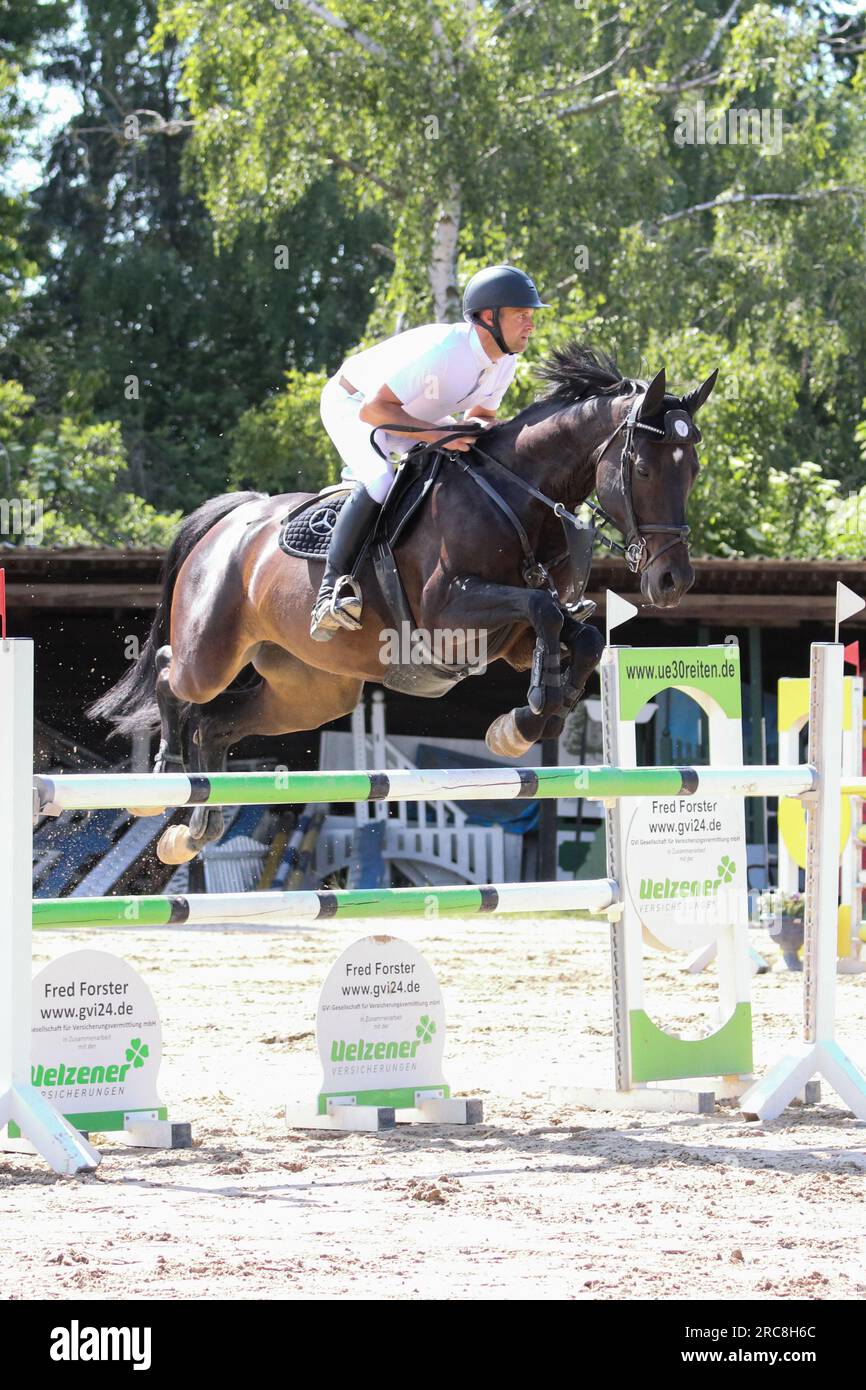 riders jump contest in germany Stock Photo - Alamy
