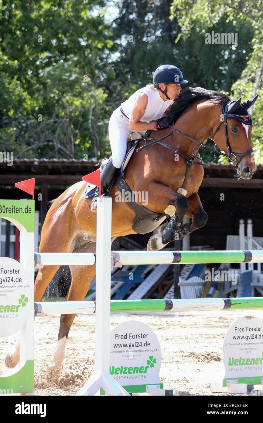riders jump contest in germany Stock Photo - Alamy