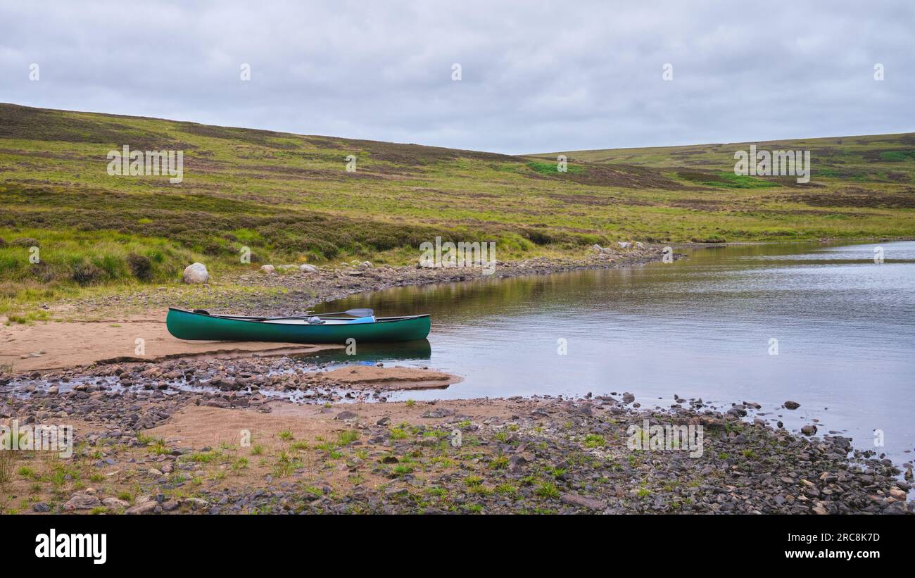 Canoe on Loch Buidhe in Sutherland Stock Photo - Alamy