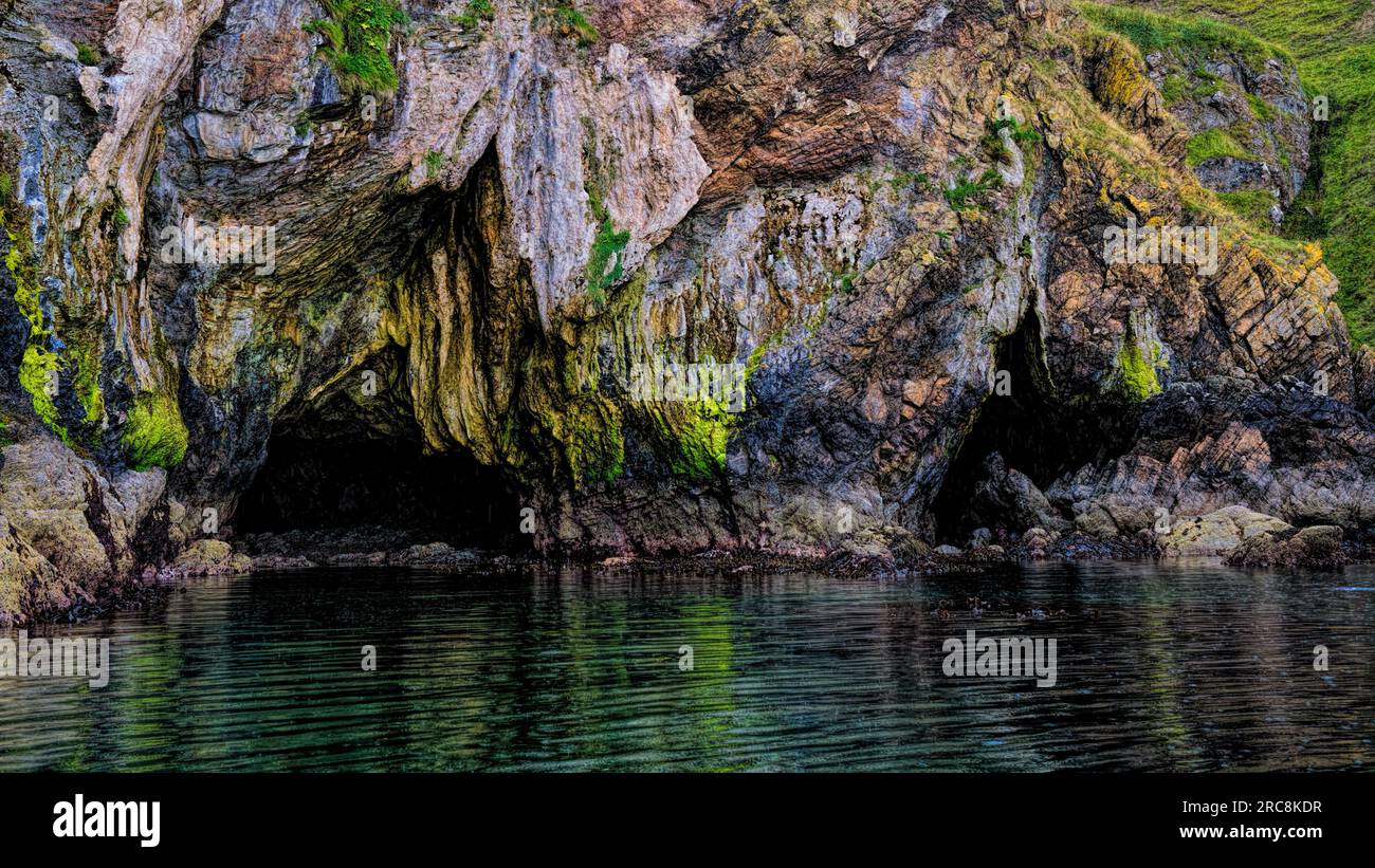 Sea caves, rock formations, and cliffs at Lybster in the Highlands ...