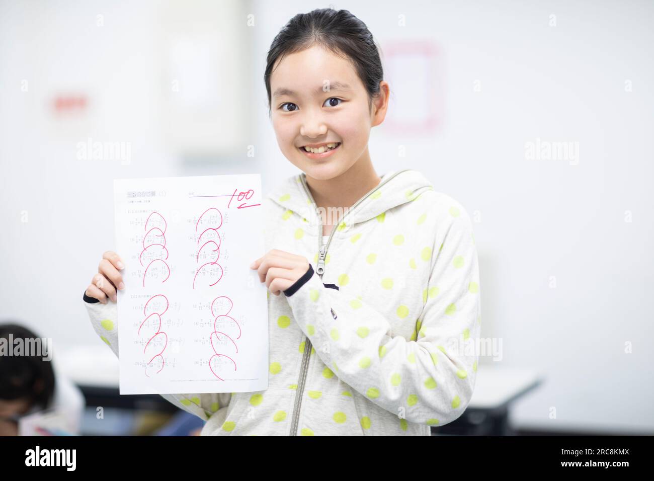 Elementary School Student Holding Test and Smiling Stock Photo - Alamy