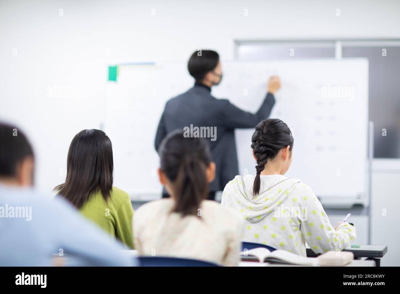 Back of Girl Taking Class Stock Photo - Alamy