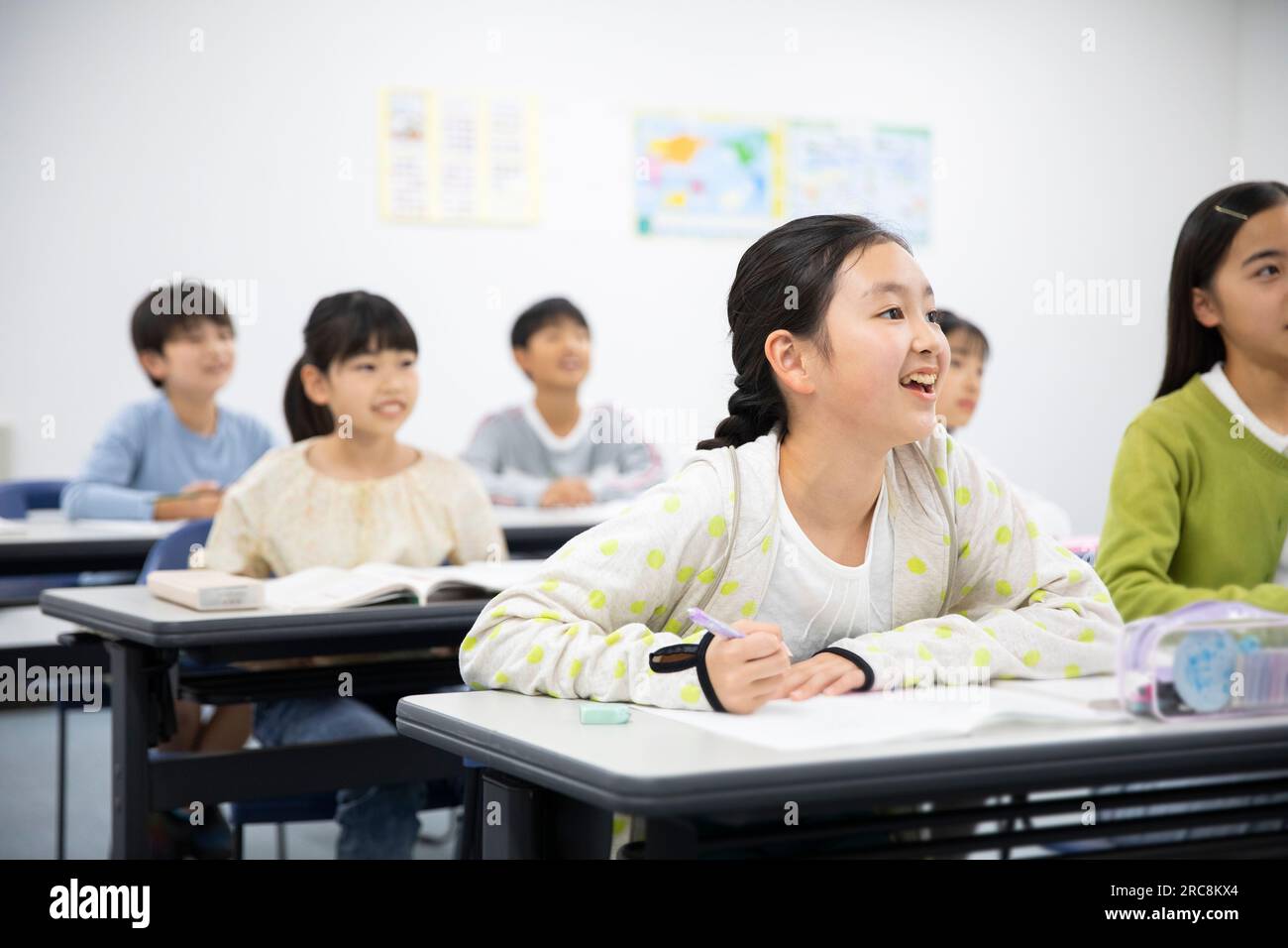 Elementary school students taking a class Stock Photo - Alamy