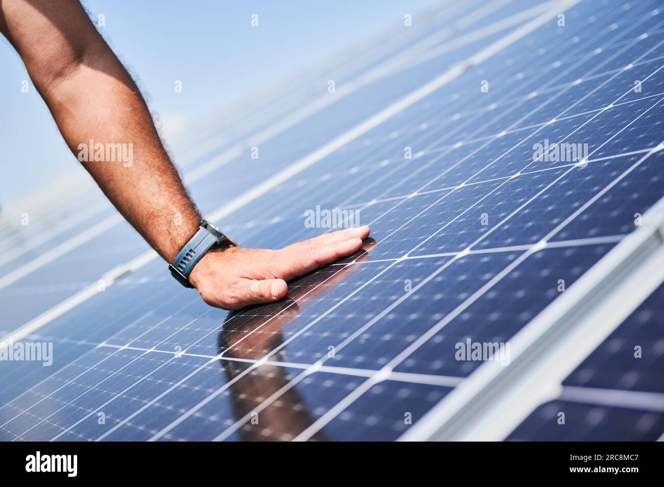 Engineer checking an operation of just installed solar battery. Close ...