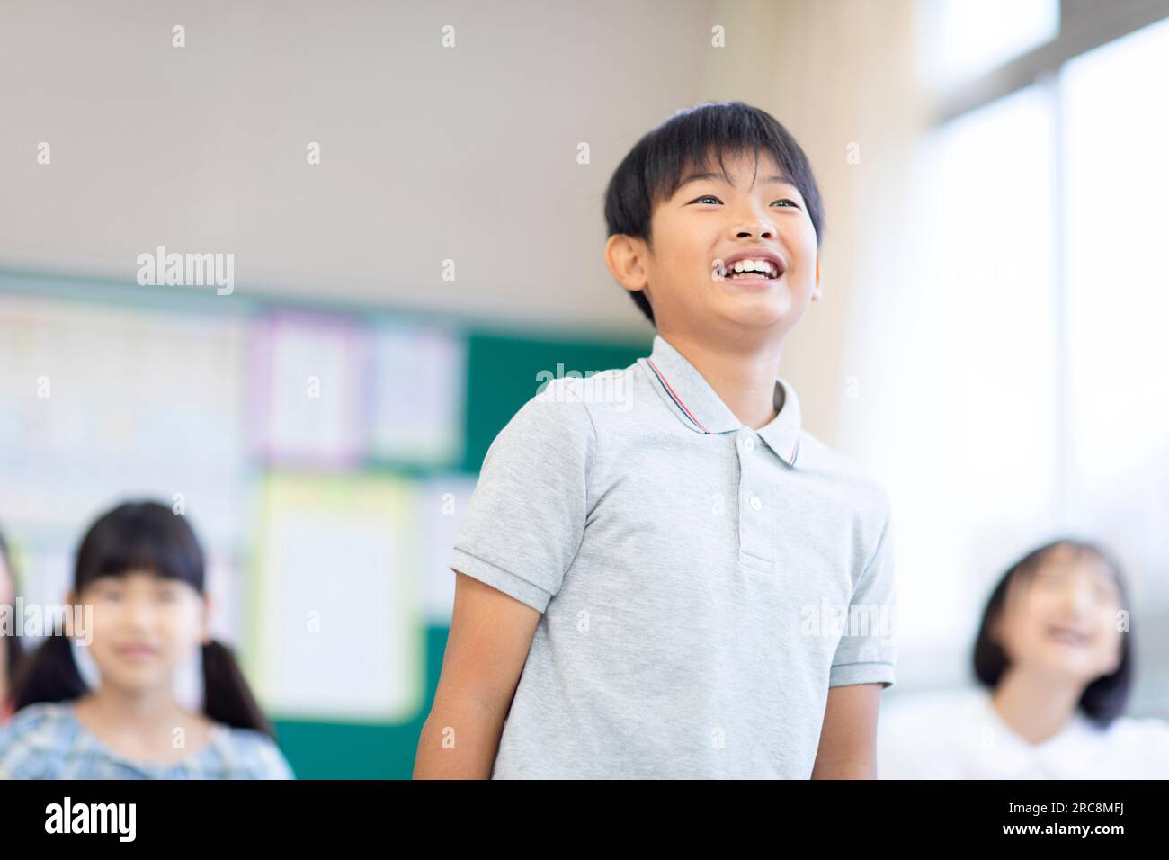 Elementary school student giving a presentation during class Stock ...
