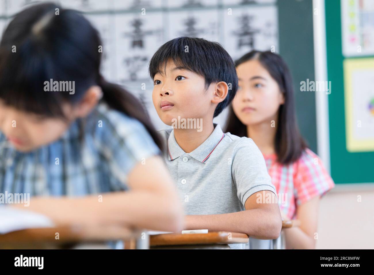 An elementary school student studying in class Stock Photo - Alamy