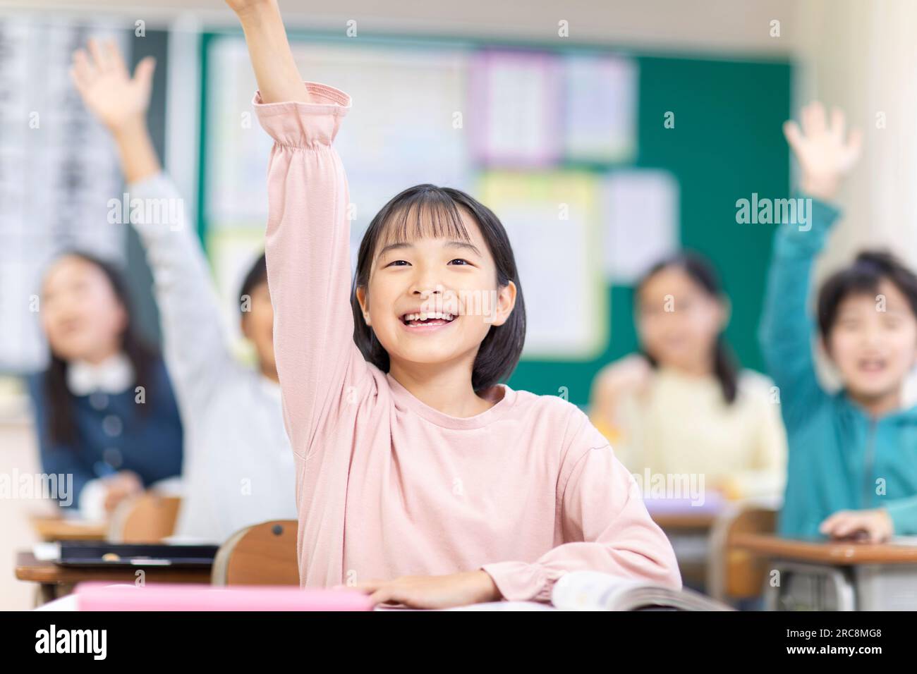 Boy raises hand hi-res stock photography and images - Alamy