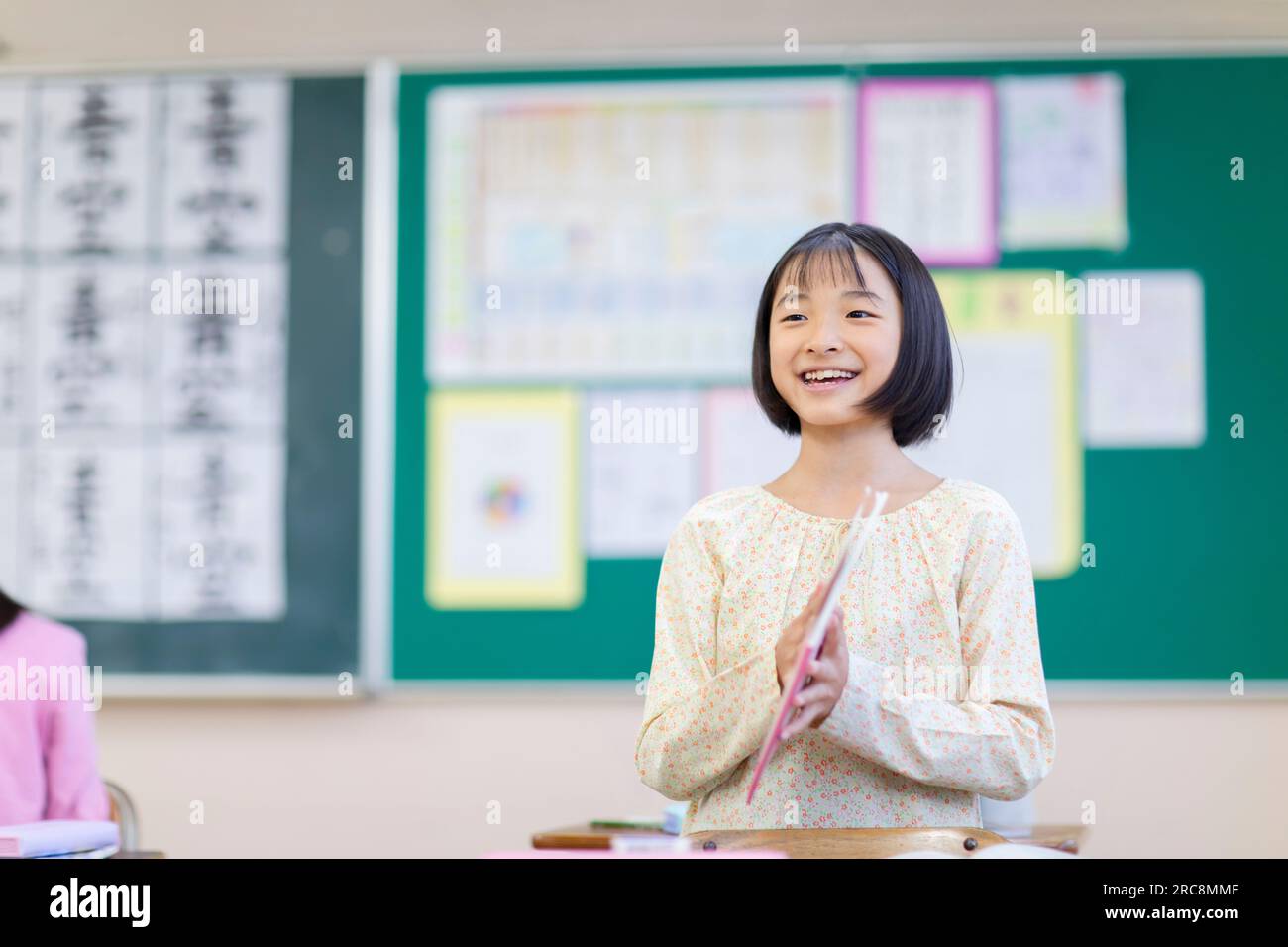 Elementary school student giving a presentation during class Stock ...