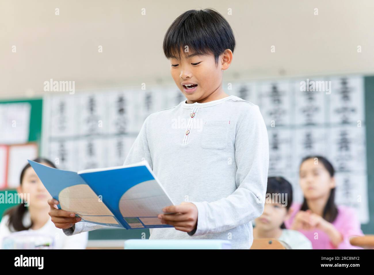An elementary school student making a presentation Stock Photo - Alamy