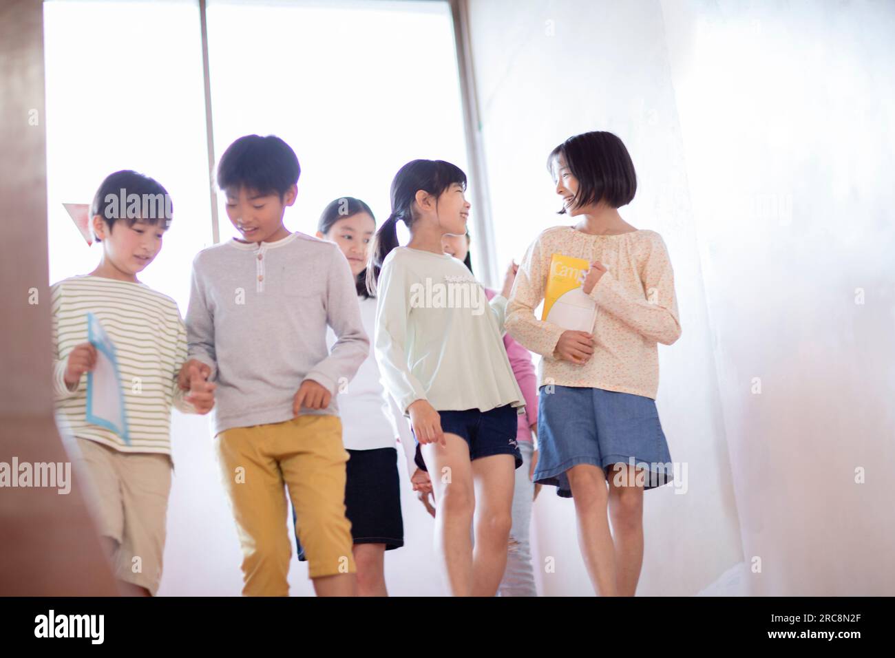 Elementary school students walking on the stairs Stock Photo - Alamy