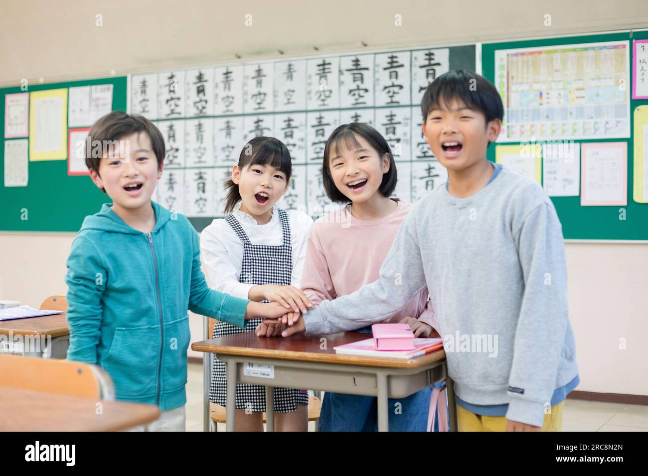 Elementary school students playing in the classroom Stock Photo - Alamy