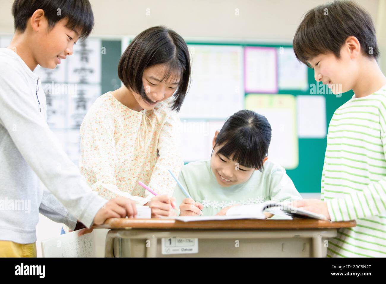 Elementary school children studying in the classroom Stock Photo - Alamy