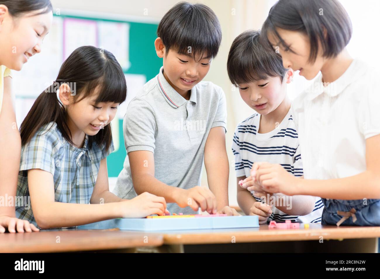 Elementary school children playing in the classroom Stock Photo - Alamy