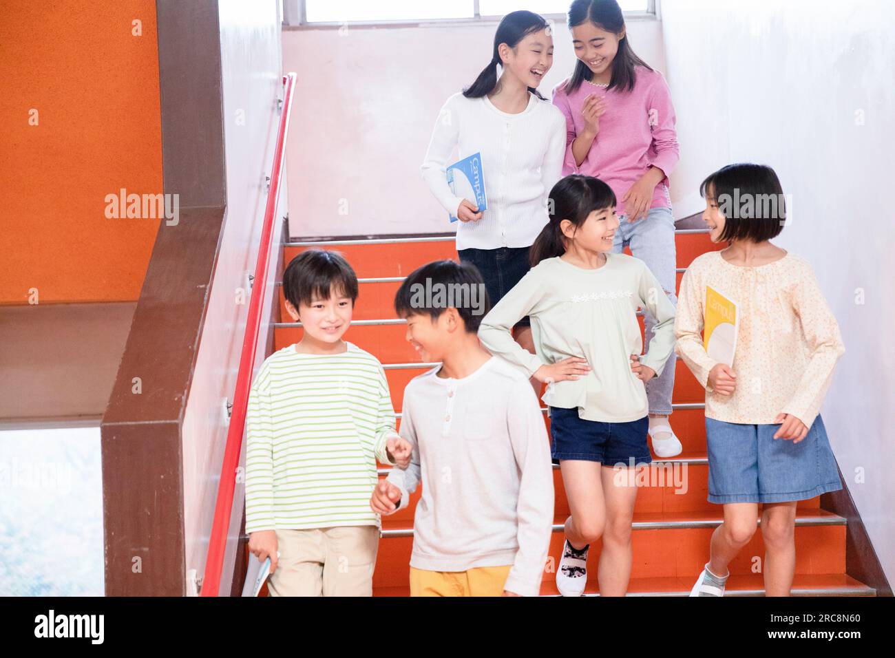 Elementary school students walking on the stairs Stock Photo - Alamy