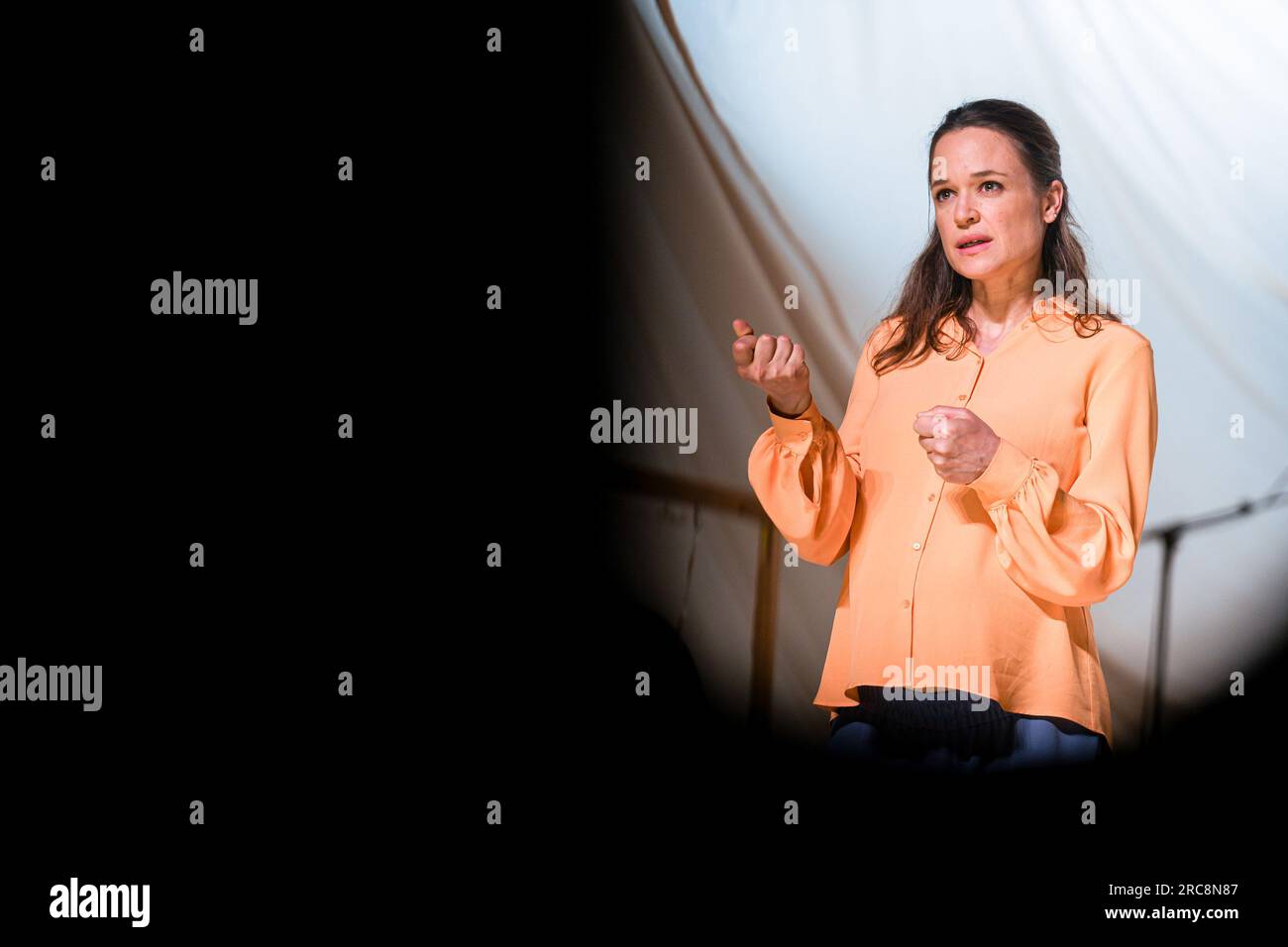 Avignon, France. 12th July, 2023. Actress Isabelle Caillat kneels on ...