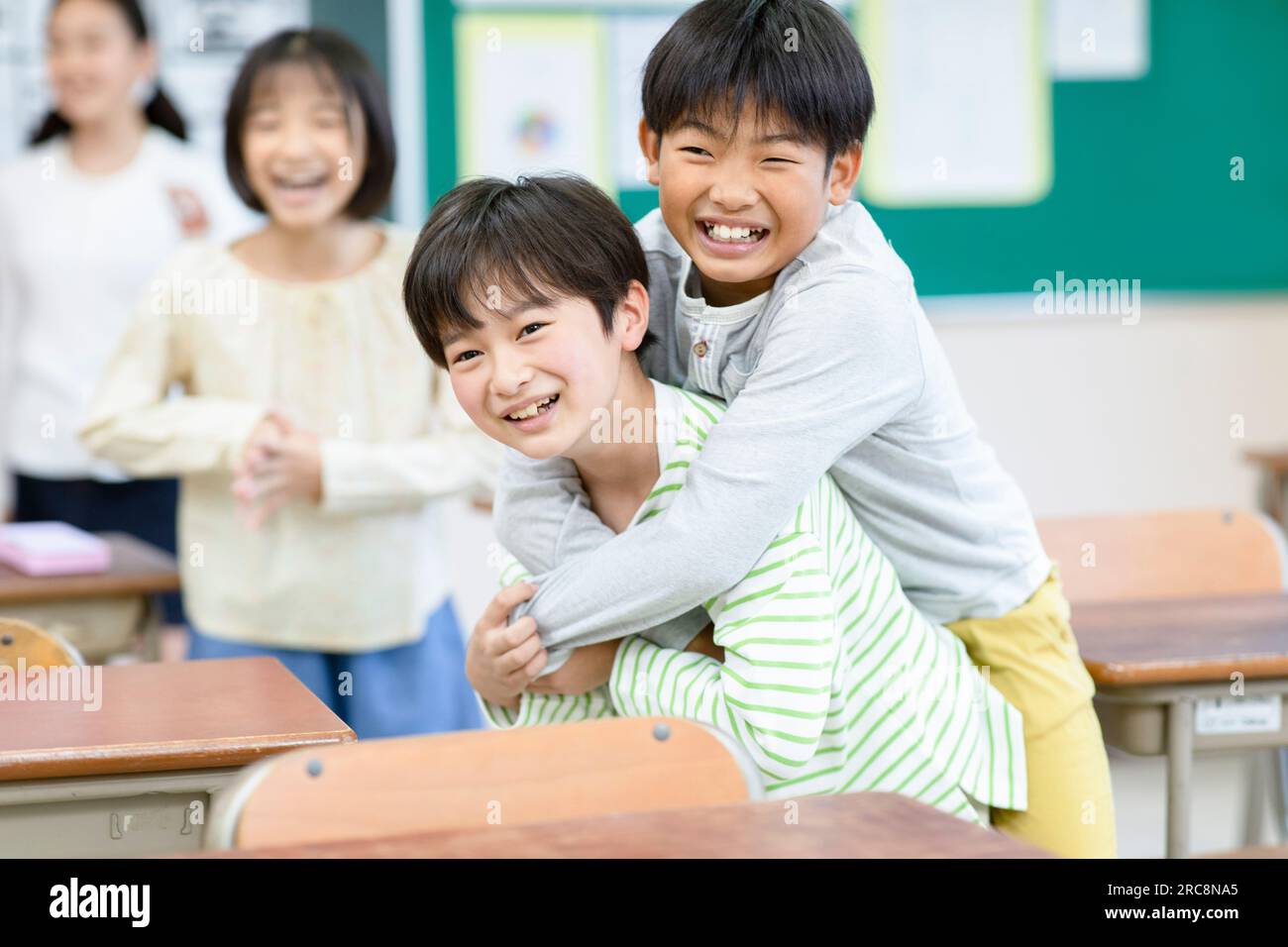 Elementary school students playing in the classroom Stock Photo - Alamy
